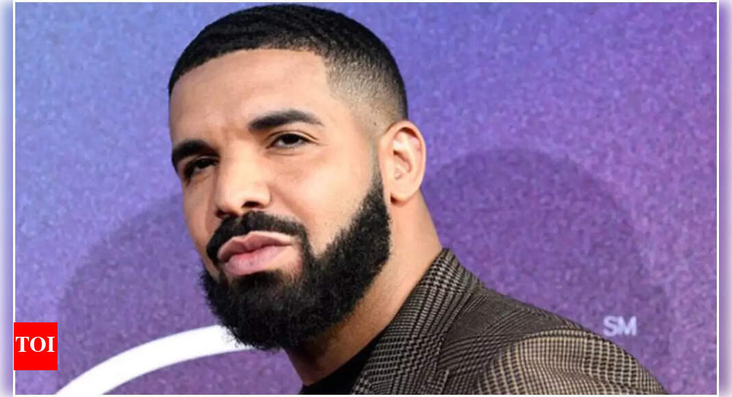 Drake leaves hotel in bulldog mask ahead of 'For All the Dogs' release ...