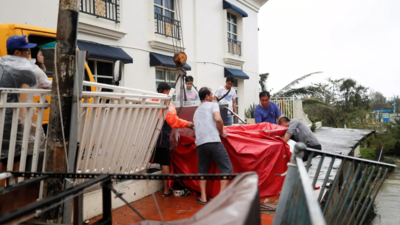 Typhoon Koinu turns south off China's coast, headed for Hainan - Times ...
