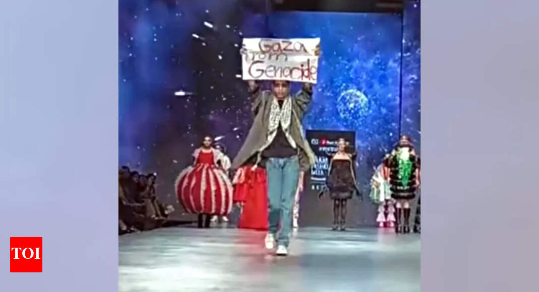 A woman interrupts a fashion show with the poster that read ‘save Gaza ...