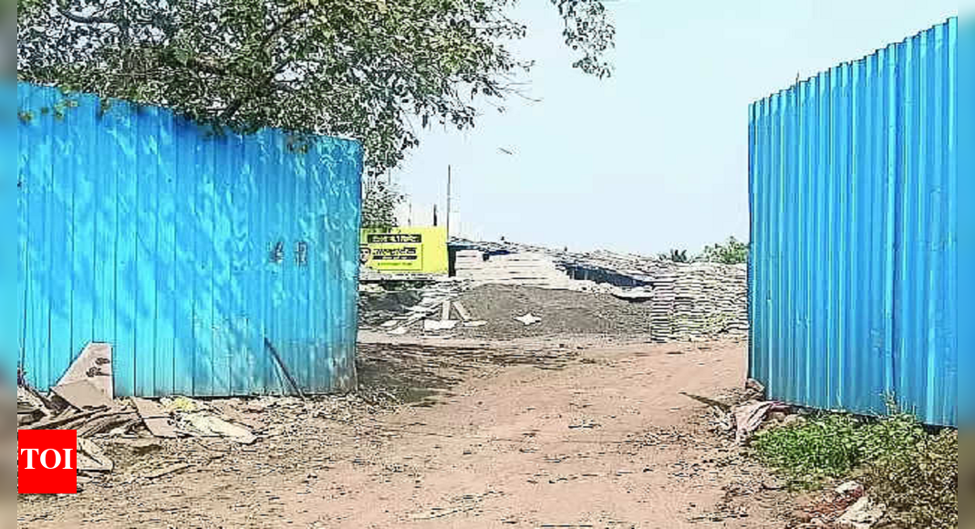 Mhada: 'Illegal' cement plant on Juhu open plot 'choking' residents | Mumbai News - Times of India