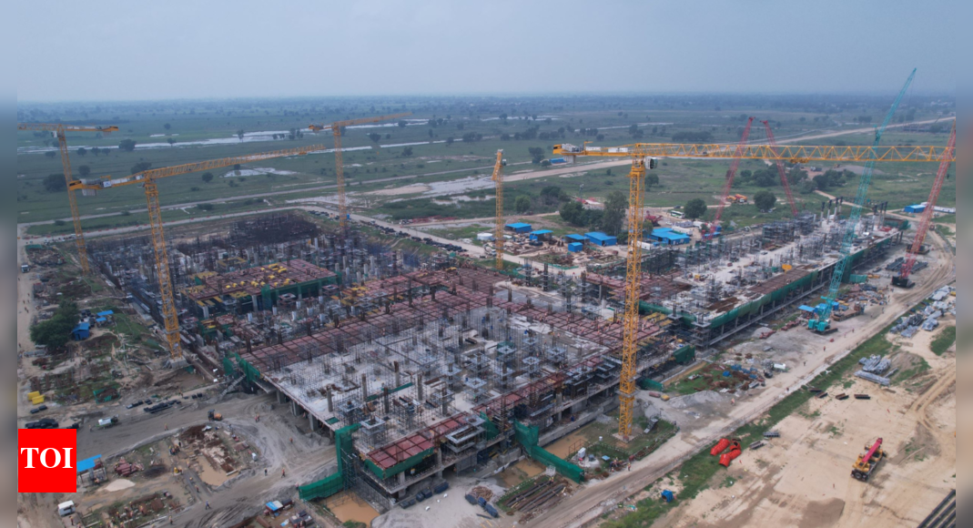 Noida Airport: Final floor level of passenger terminal reached, façade ...