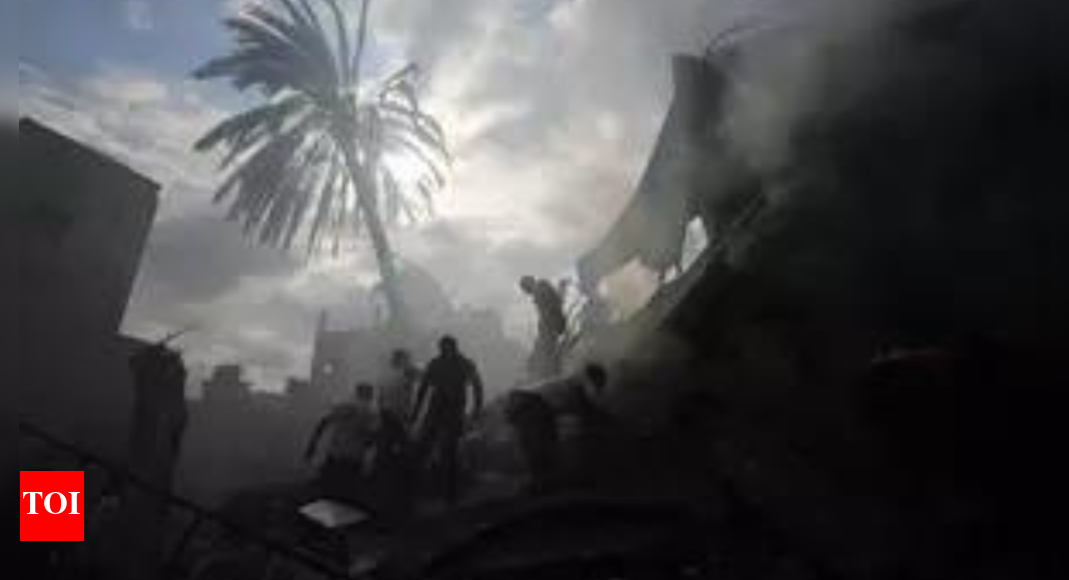 Gaza: Gaza workers wrap bodies in shrouds in bombed-out northern Gaza ...