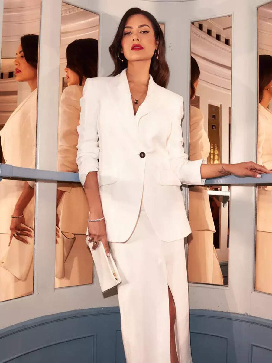 Esha Gupta showcases her fashion prowess in a crisp white skirt suit ...