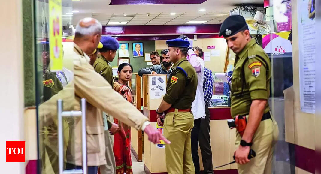 Bank cashier shot while fighting off robbers, now fighting for life ...