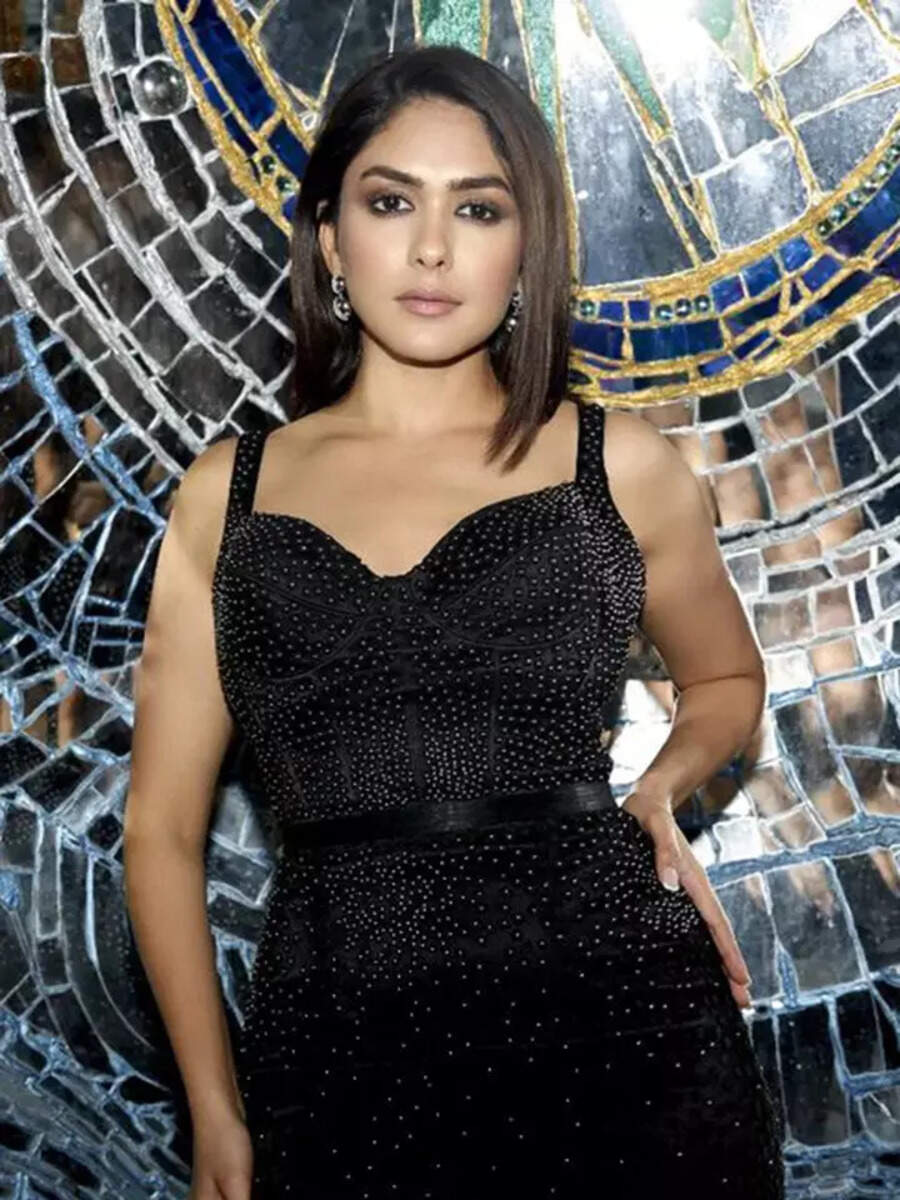 Mrunal Thakur commands attention in black pearl-studded dress | Times ...