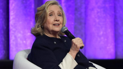 Hillary Clinton: 'Don't vote for anyone you wouldn't trust with your dog' - Times of India