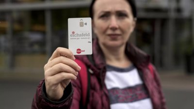 Migrants on cards: German policy sparks controversy over integration ...