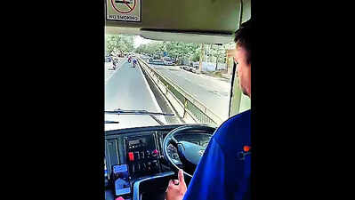 BRTS Bus Driver: Driver watches reels at wheel, operator fined ₹2L ...