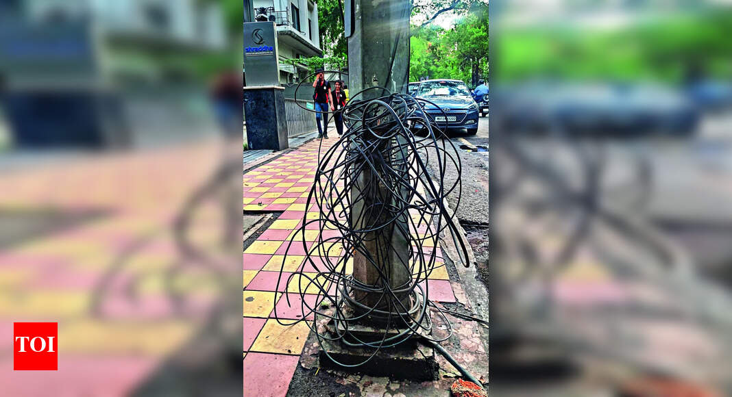 Cables: Loose cables trip pedestrians, twist around 2-wheelers | Pune News - Times of India
