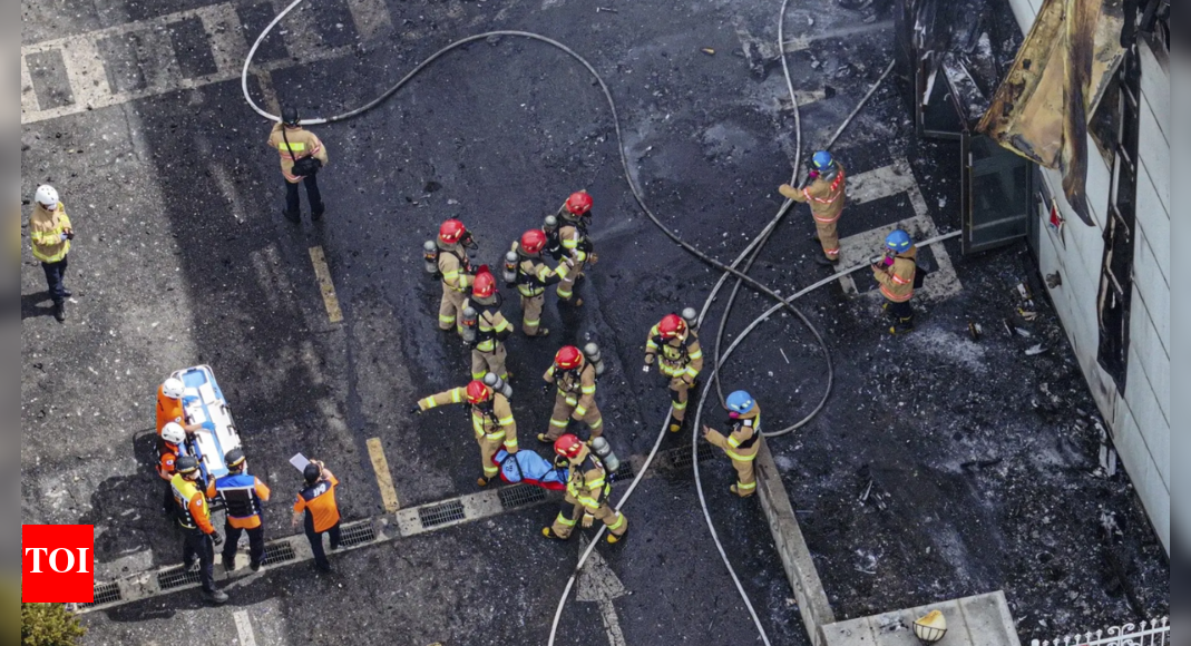 South Korean rescuers search burned factory after a blaze killed 22 ...