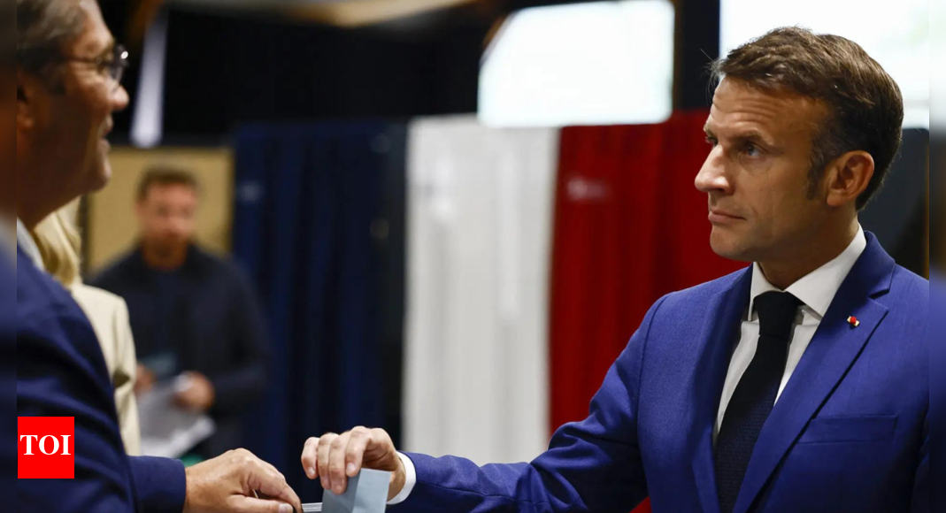 French President Emmanuel Macron casts his vote in first round of ...