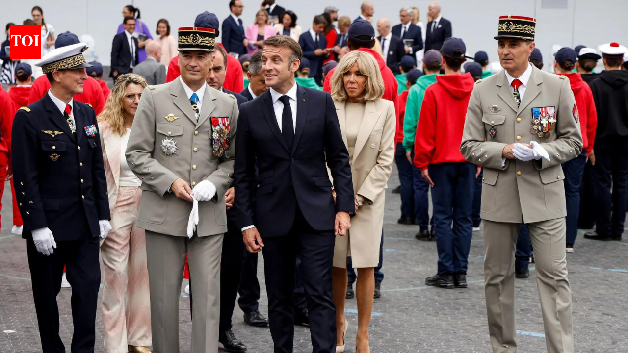 In pics: France’s Bastille Day parade meets Olympic torch relay in an ...