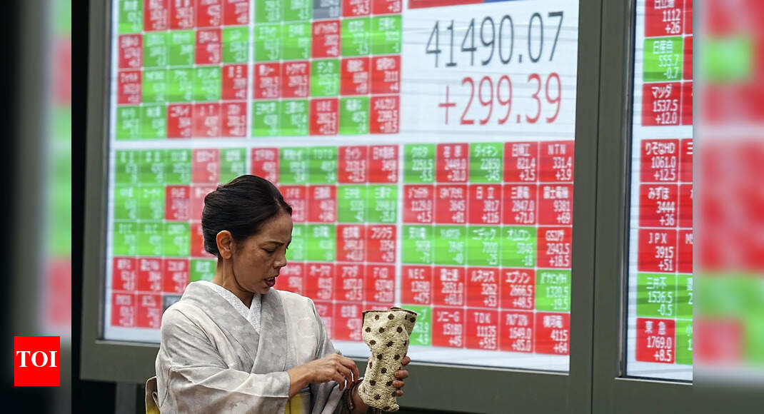 Japan's Nikkei tracks Wall Street lower; chip gains cap losses - Times ...