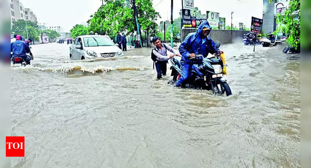 Surat City: Heavy rain disrupts life in Surat city | Surat News - Times of India