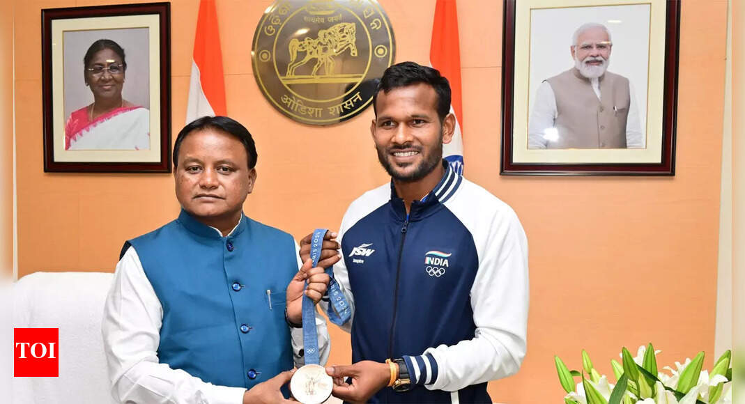 Odisha CM Mohan Charan Majhi felicitates star hockey player Amit ...