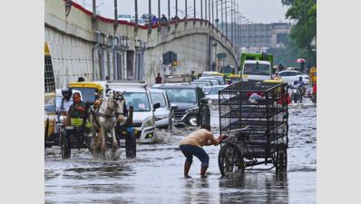 Flooding and crumbling roads at Minto bridge underpass cause commuter woes in Delhi | Delhi News ...