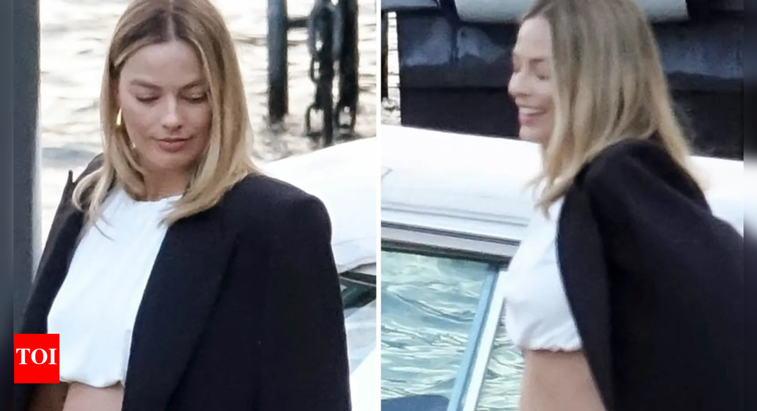 Margot Robbie shows off her baby bump for the first time on the red ...