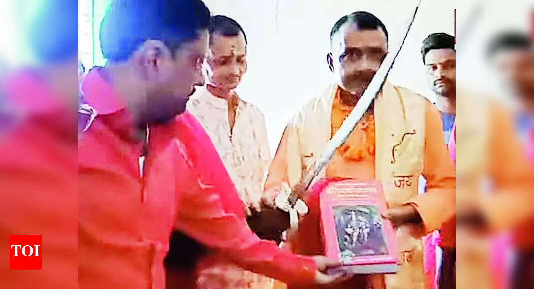 BJP MLA Sparks Controversy by Distributing Swords During Durga Puja ...