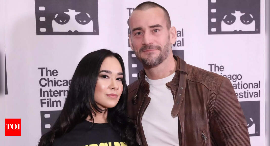 CM Punk Surprises AJ Lee with Roses & Love: Couple Goals at Comic Book ...