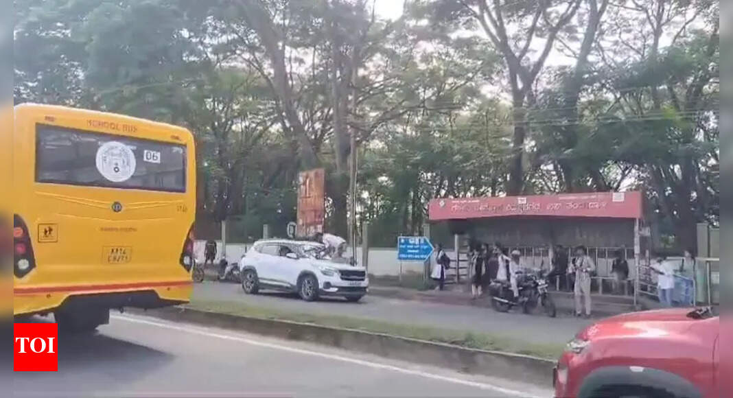 'Escaped death': Karnataka traffic cop dragged on car bonnet | Bengaluru News - Times of India