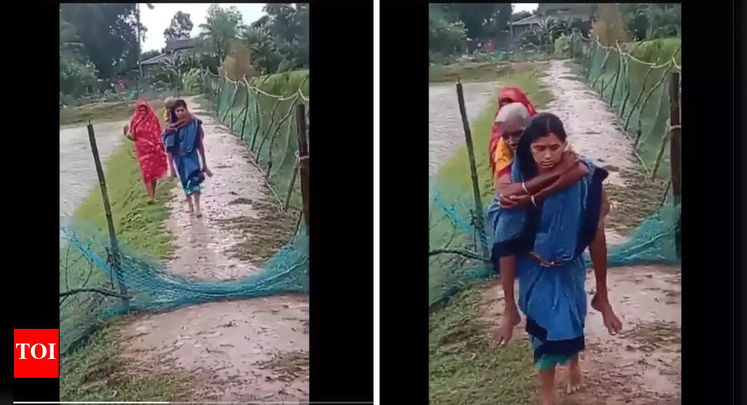Cyclone Dana: ASHA worker carry an elderly women on her shoulders to ...