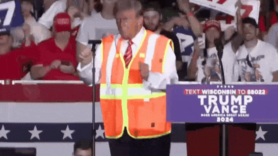 Watch: Trump turns up the trash talk, dances to YMCA in safety vest ...