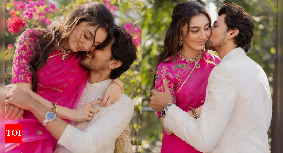 Singer Darshan Raval's regal sherwani and Dharal Surelia’s vibrant pink ...