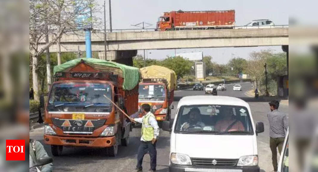 Heavy vehicles turn city roads into risky tracks - The Times of India