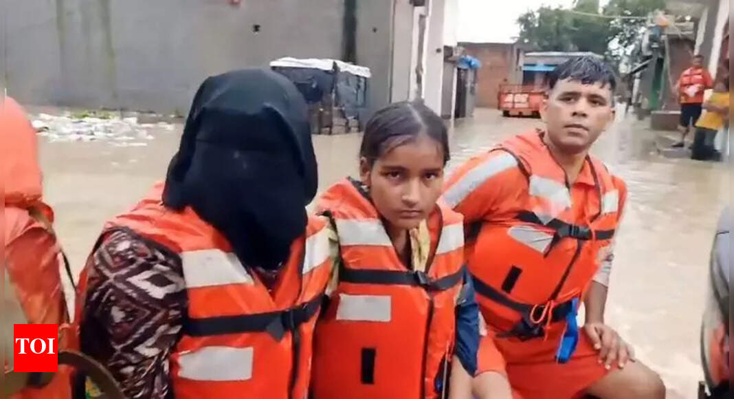 25 families rescued by NDRF from flooded Gzb villages | Noida News - The Times of India