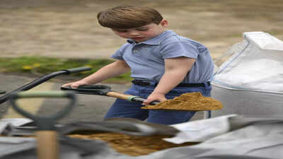 The sweet moment Prince Louis picked up a shovel for his first royal ...