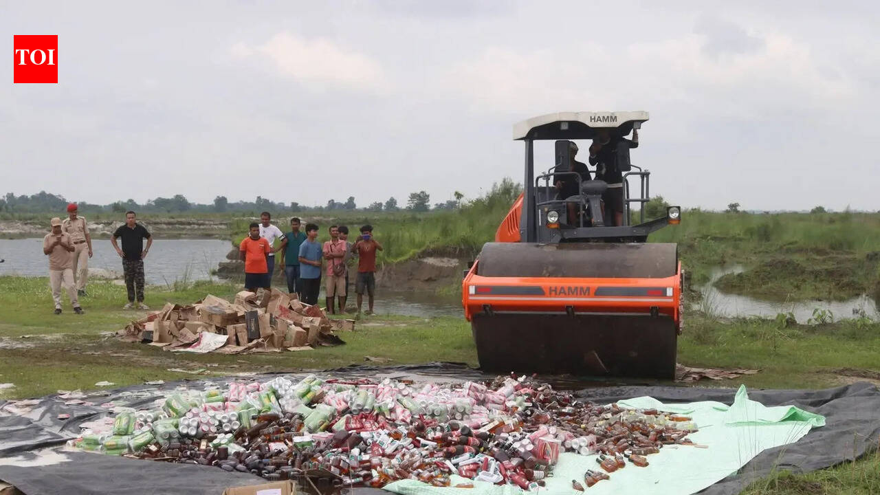 Majuli police use road rollers to crush bottles of illegal liquor ...