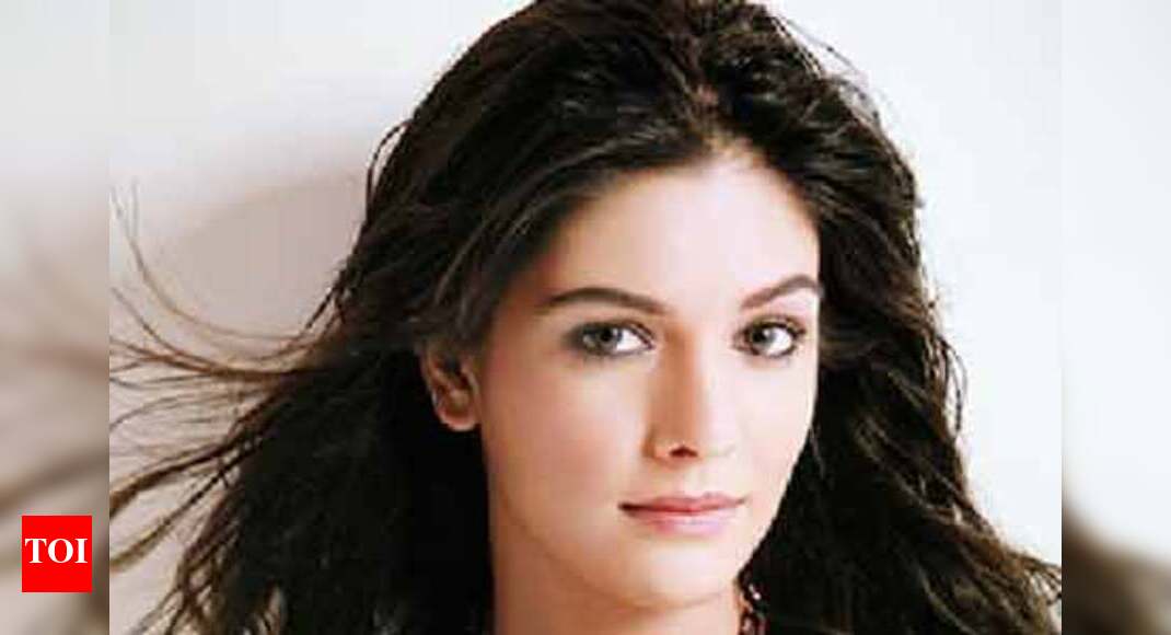 Pooja carries a swiss knife - Times of India