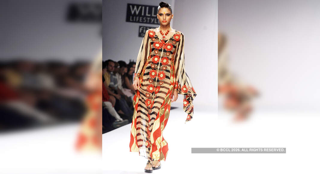 A model walks the ramp for designer Malini Ramani on Day 4 of the Wills ...