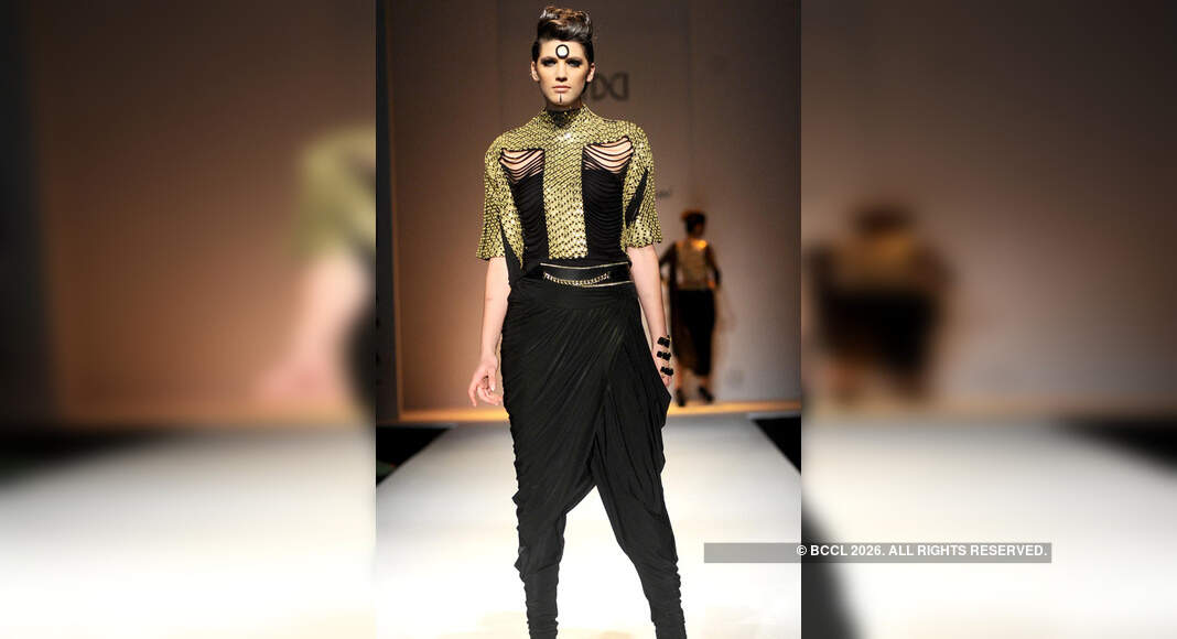 A model walks the ramp for designer Malini Ramani on Day 2 of Wills ...