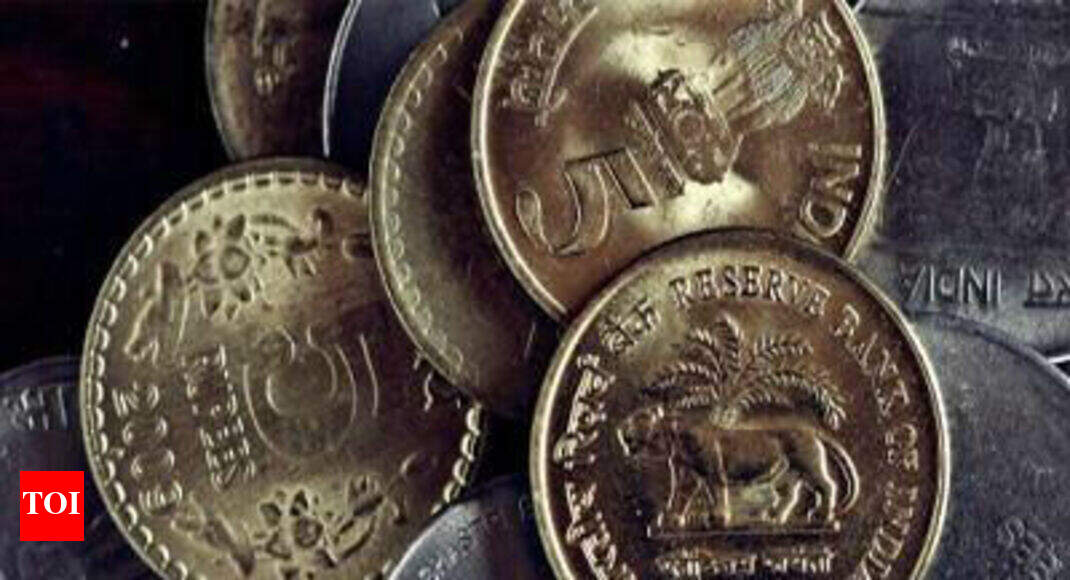 Rupee logs first drop in four days to end at 59.20 - Times of India