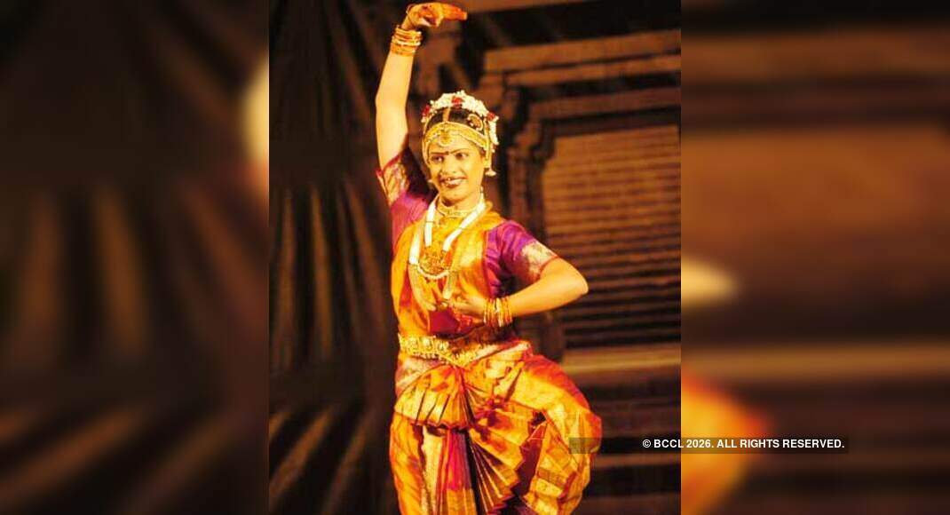 A Bharatnatyam dancer performs during her 'Arangetram' organised by ...