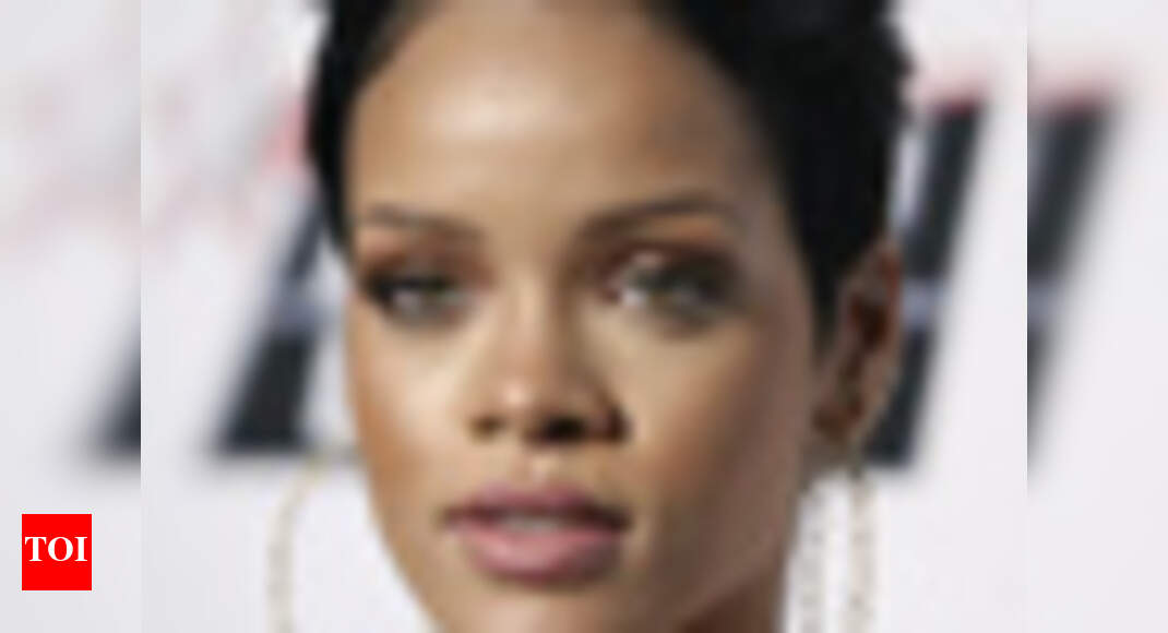 Rihanna gets a gun tattoo! | English Movie News - Times of India