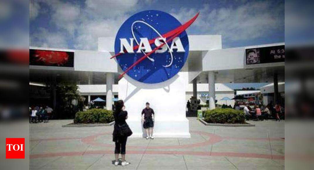 Nasa's adhesive grippers to catch space debris - Times of India