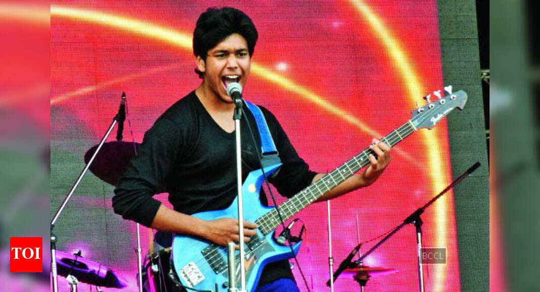 Aditya performs with his rock band during annual function of an ...
