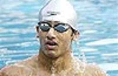Khade signs off with gold and record | More sports News - Times of India