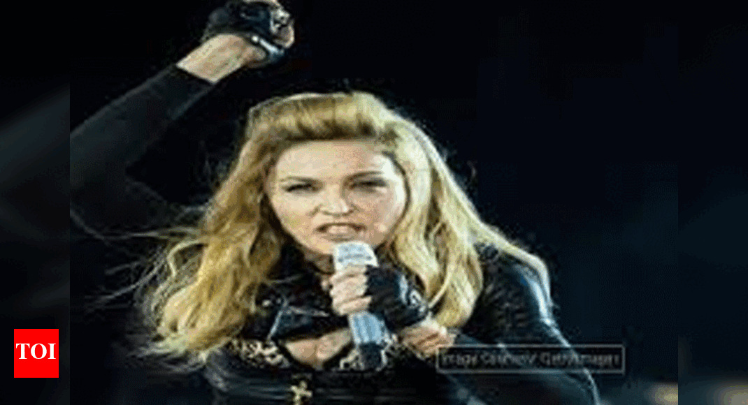 Madonna cries onstage as she pays tribute to Paris victims | English ...
