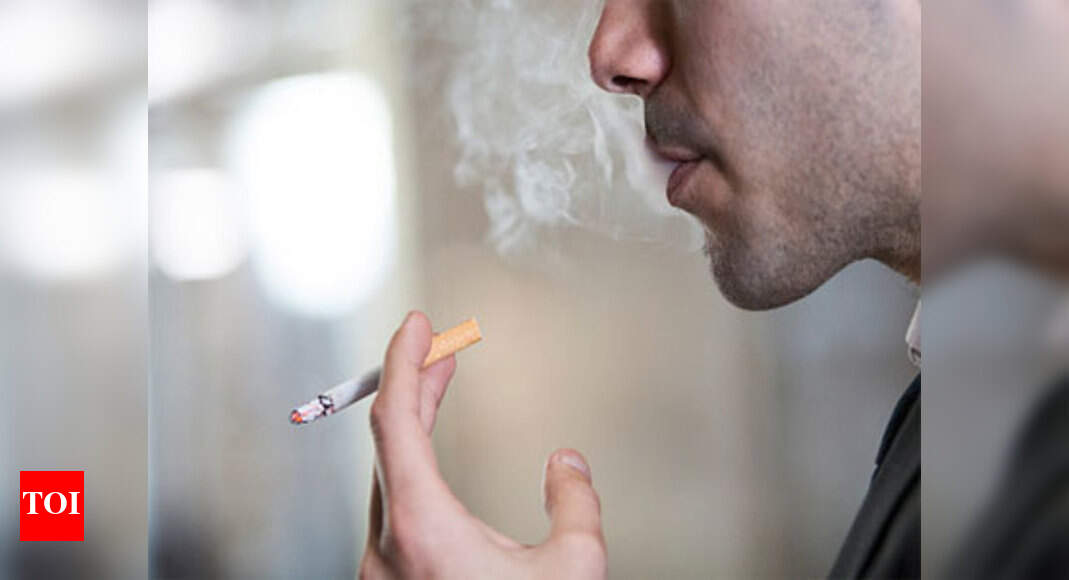 Smoking dads can pass cancer genes to kids - Times of India