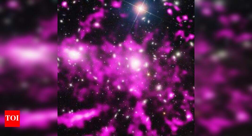 Dust doughnut around massive black hole is clumpy, study shows - Times ...