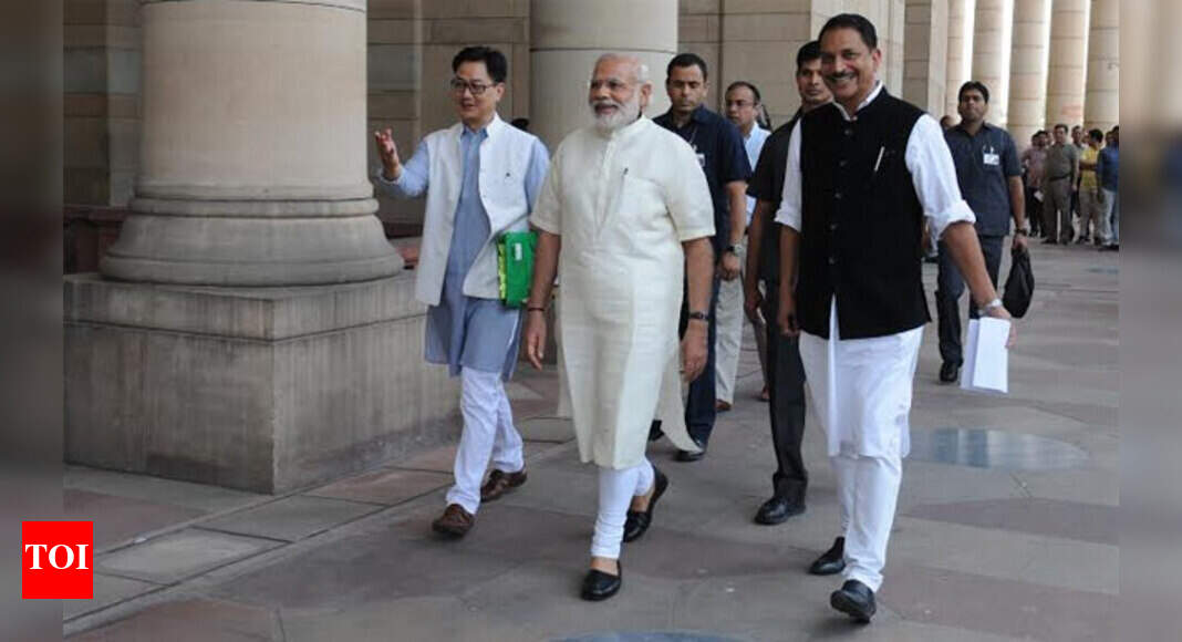 PM Narendra Modi shakes hands with opposition leaders in Rajya Sabha ...