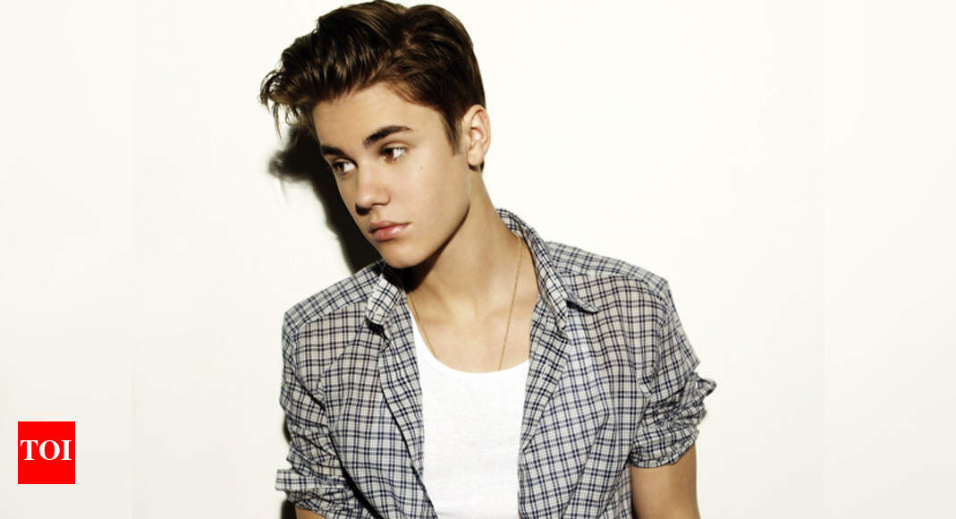 Justin Bieber pictured playing with lion cub | English Movie News ...