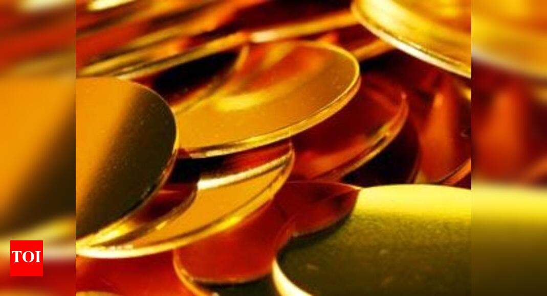 Gold perks up on global cues, jewellers' buying - Times of India