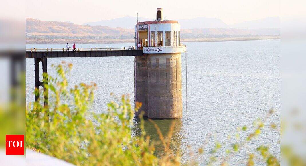 Gangapur dam filled to the brim, water discharge begins | Nashik News - Times of India