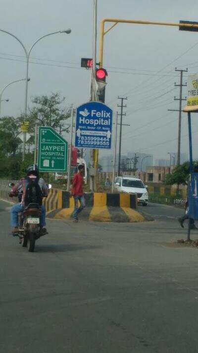 Hoarding blocking view of Noida signal removed - Times of India