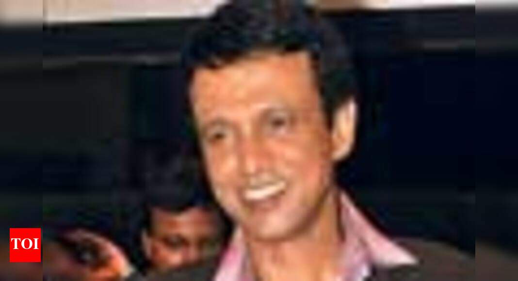 Menon 'plays' the supportive husband! | Events Movie News - Times of India