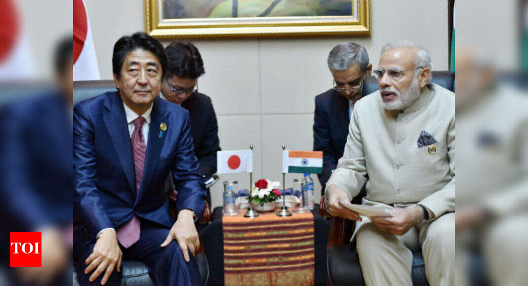 Modi meets Abe in Laos | India News - Times of India